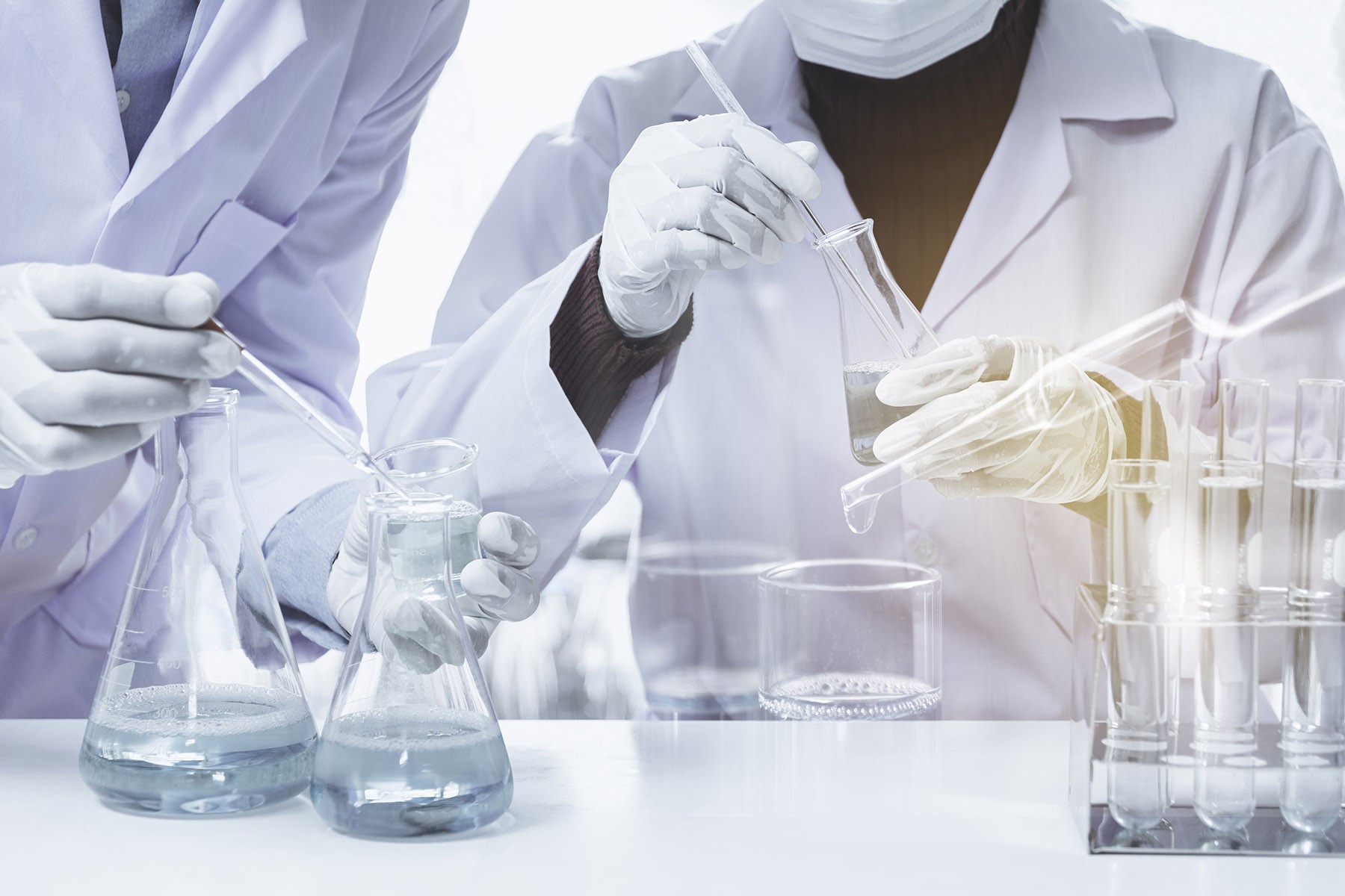 Researcher with glass laboratory chemical test tubes with liquid | S.K ...